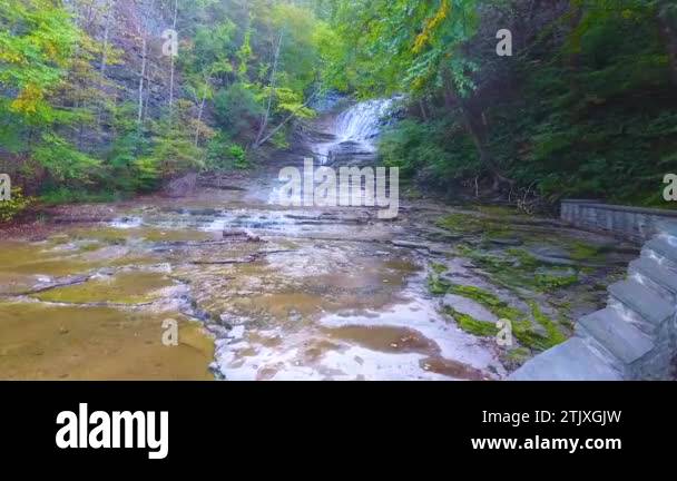 Video of Aerial pan across path over river with huge cascading ...