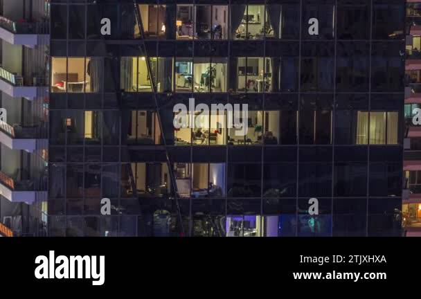 Windows lights in modern office and residential buildings with ...