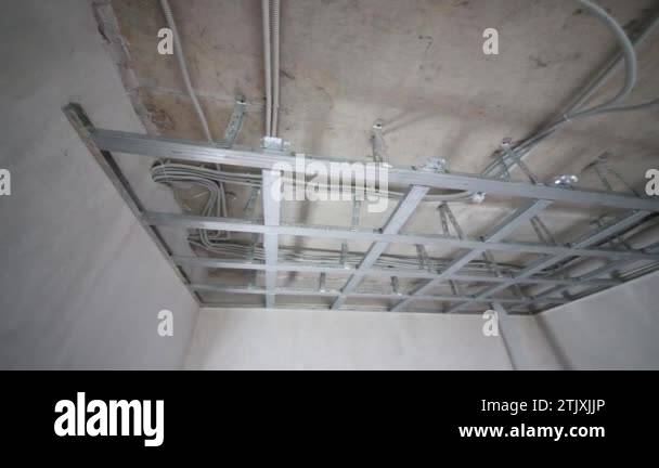 Metal profile for ceiling and finished hung ceiling in room Stock Video ...