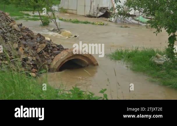 There was damage caused by flooding on farm field after heavy rain ...
