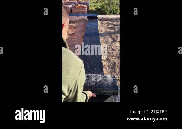 Roll waterproofing of the foundation of the building before the start ...