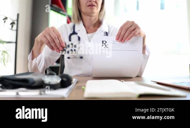 Hand of medical doctor gives prescription to patient and pills closeup ...