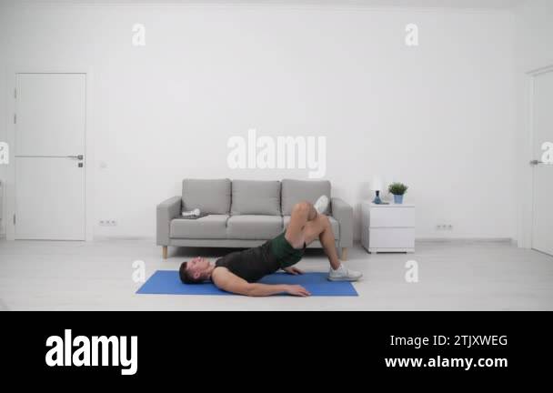 fitness workout concept. fitness athlete do glute bridge at home ...