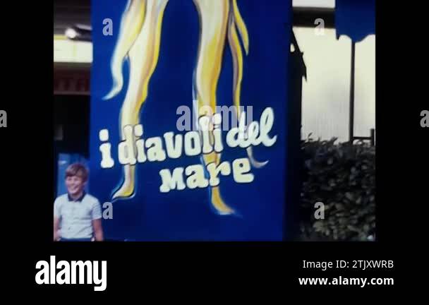 palermo, italy march 1970 : people and children under attraction sign at playground in 70s Stock ...