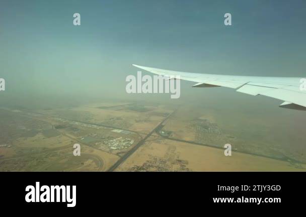 Video from the plane on its wing, the land of Dubai beneath it and a ...