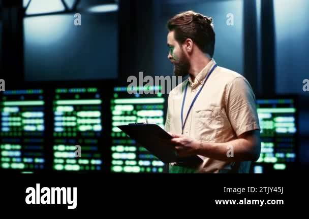 Admin walking in data center supporting AI through high performance computing, hosting ...