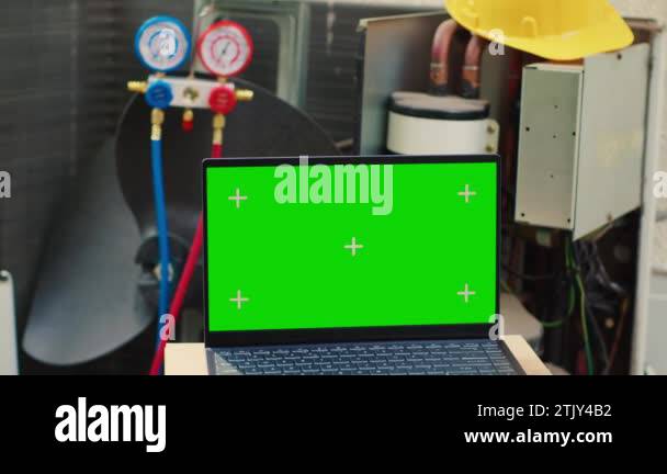 Chroma key laptop in front of unfunctional opened external air ...