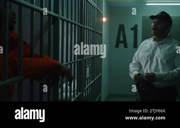 Warden with baton comes to jail cells and starts bullying prisoners ...