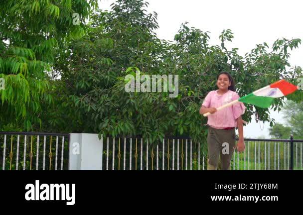 Celebrating Independence or Republic day, Indian girl holding, waving ...