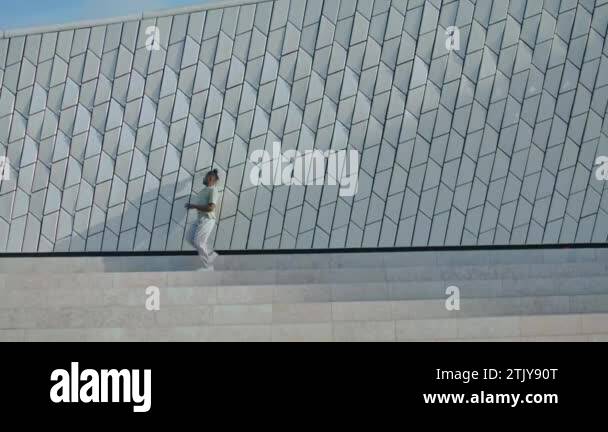 Graceful dancer training modern street. Creative man dancing contemp ...