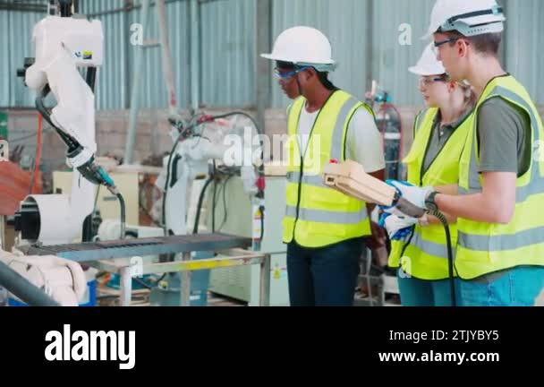 Team engineer man and woman talking and explaining about robot arms ...