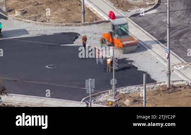 Asphalt paver, roller and truck from above. Construction site of avenue ...