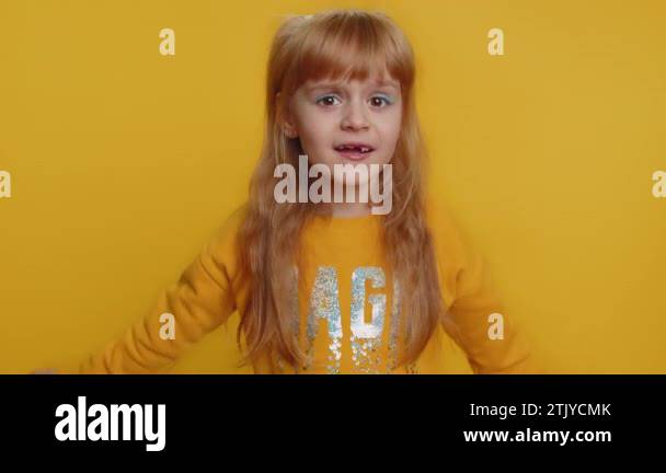 Young preteen child girl kid raising hands in indignant expression ...