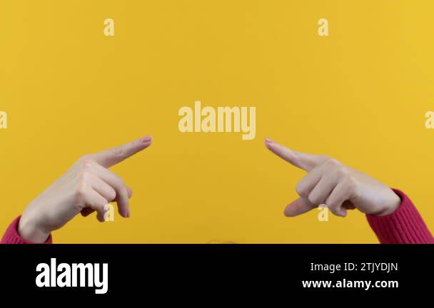 Recommending woman with hands pointing on center - copy space. Lady ...