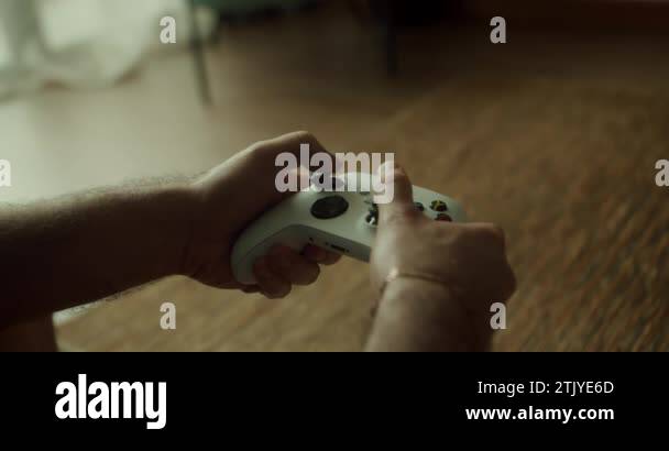 Child gamer hands holding modern console for play station close-up, guy ...