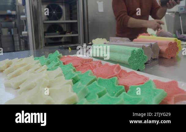 baker slicing red violet yellow and green star cloud and heart shaped ...
