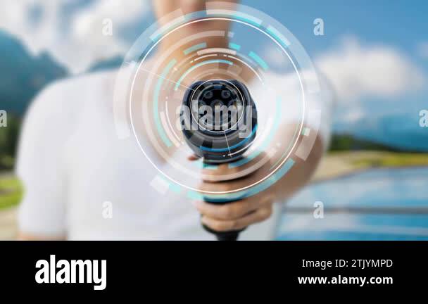 Focus EV charger pointing in front of camera display futuristic eco ...
