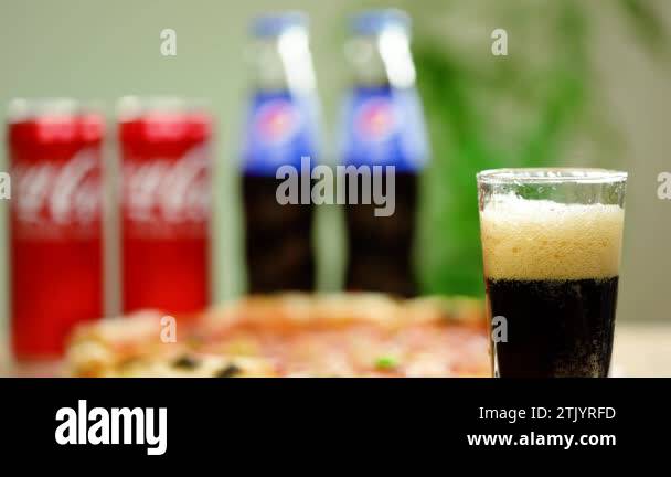 Appetizing Italian pizza and a bottle of Pepsi and Coca Cola. Soda ...
