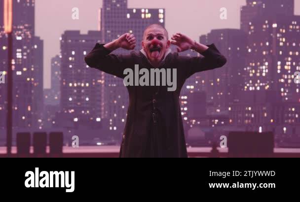 Clown funny mime behind an invisible glass box or wall. Entering the ...