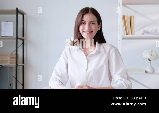 Female vlog. Online interview. Live streaming. Successful amused woman greeting waving hello ...