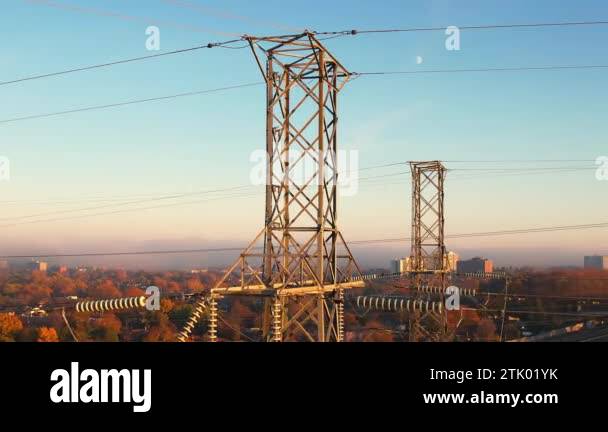 High voltage electric towers at golden hour sunset. Transmission power ...