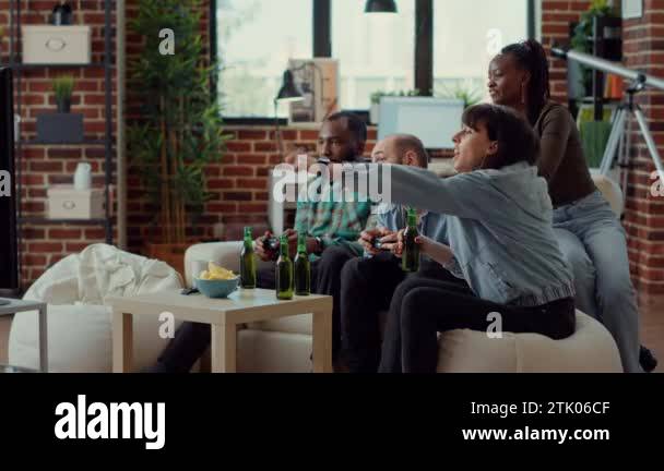 Diverse friends feeling angry about losing video games play, playing ...