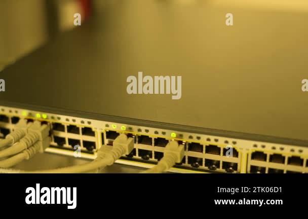 blinking LED lights in a server rack with RJ45 and fiber optic cable ...