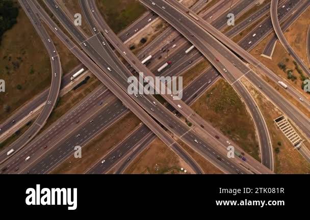 Top down aerial of cars drive across the expressway road in Canada ...
