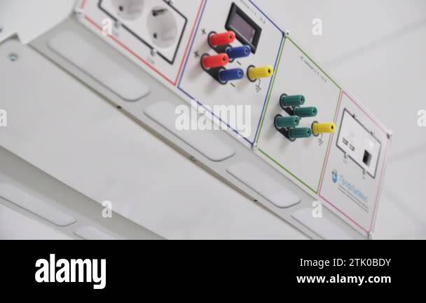 Power supply system attached to wall and contains buttons and valves of ...