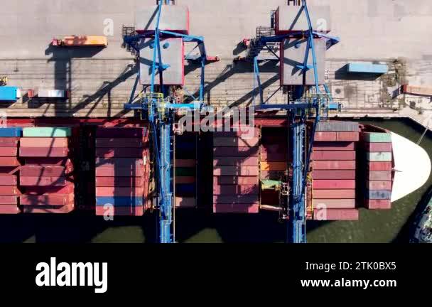 Container ship loading and unloading in port, Aerial view of logistic ...