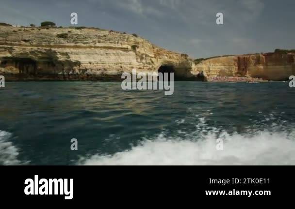 sea panorama of golden cliffs of Praia de Benagil, Algarve by Lagoa in ...