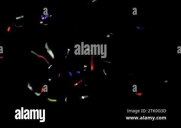 Studio close shot of real metallic multi-colored confetti tinsel ...