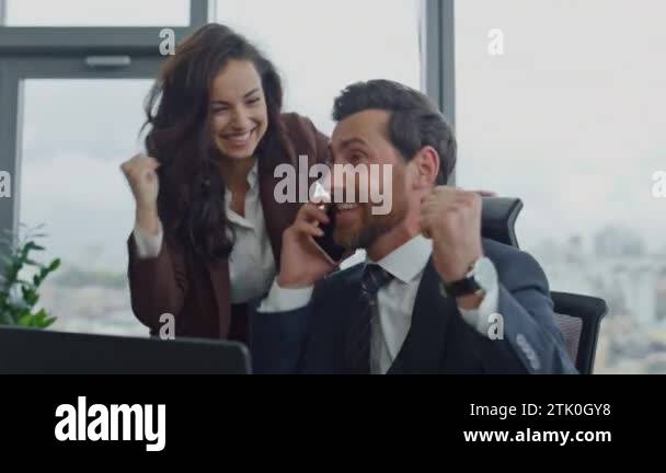 Two business partners giving five celebrating professional success ...