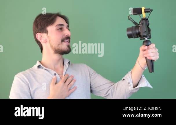 influencer man shoots self-introducing video, friendly young man taking ...