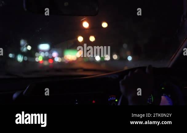 Unrecognizable woman pay attention on the road while driving a car in ...