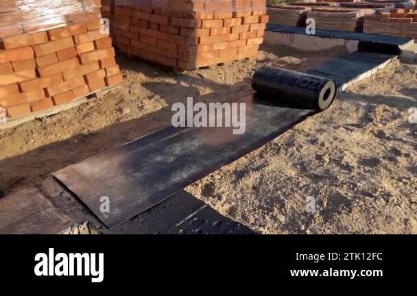 Roll waterproofing of the foundation of the building before the start ...