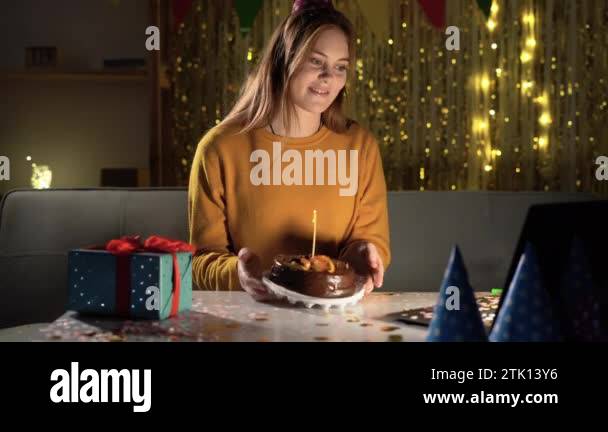 Virtual Celebration. Happy young woman in party hat celebrating ...