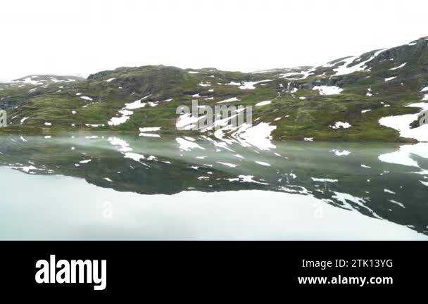 Alpine lakes in Norway are covered with ice all year round. Mountain ...