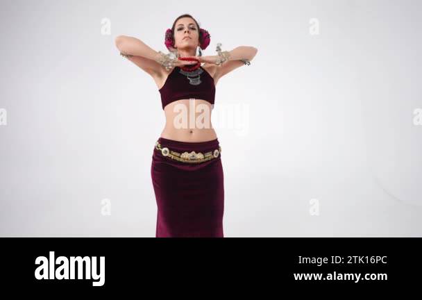 Smiling beautiful woman shaking chest turning shaking hips in slow ...