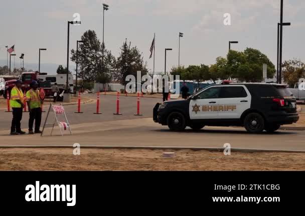 Sheriff Police Car pulling into a Parking Lot on a Daytime at the ...