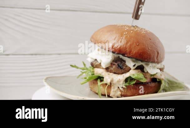 Cool beautiful fresh juicy cooked burger rotate on turntable, on white ...