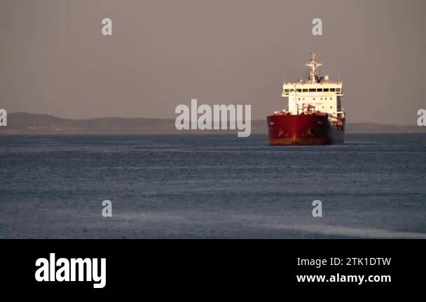 A containerized cargo ship enters the port for unloading. Big container ...