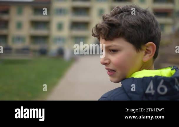 One upset preteen child turning head with concerned emotion. Tracking ...