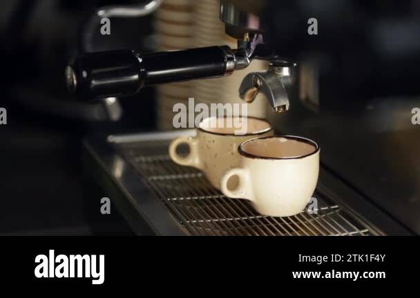 Slow-motion video of espresso pouring with a coffee machine in a cafe ...