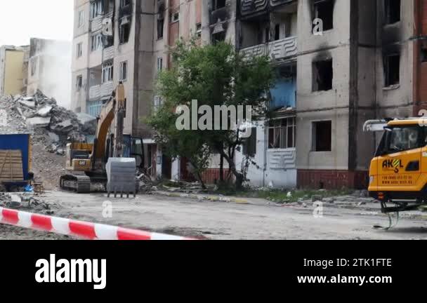 Demolition of a high-rise building. House collapse. Construction work ...