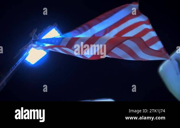 American flag flutter in the wind at night. USA American flag. Waving ...