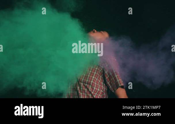 an Asian man was thrown color powder by his friends during the color ...