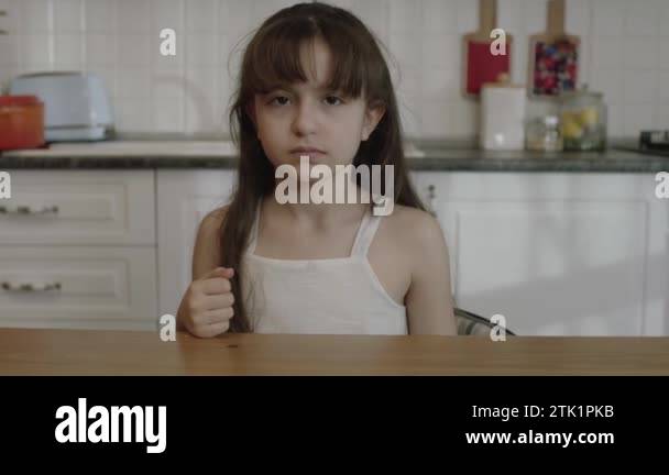 Little girl angry, angry and disobedient at bad behavior showing middle ...