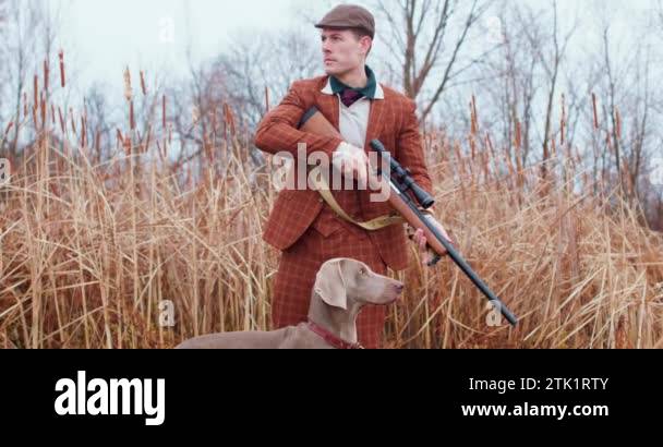 serious confident hunter in traditional shooting clothes outfit ...