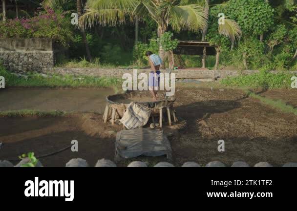Traditional Salt Making Process on the beach sea shore Bali, Indonesia ...
